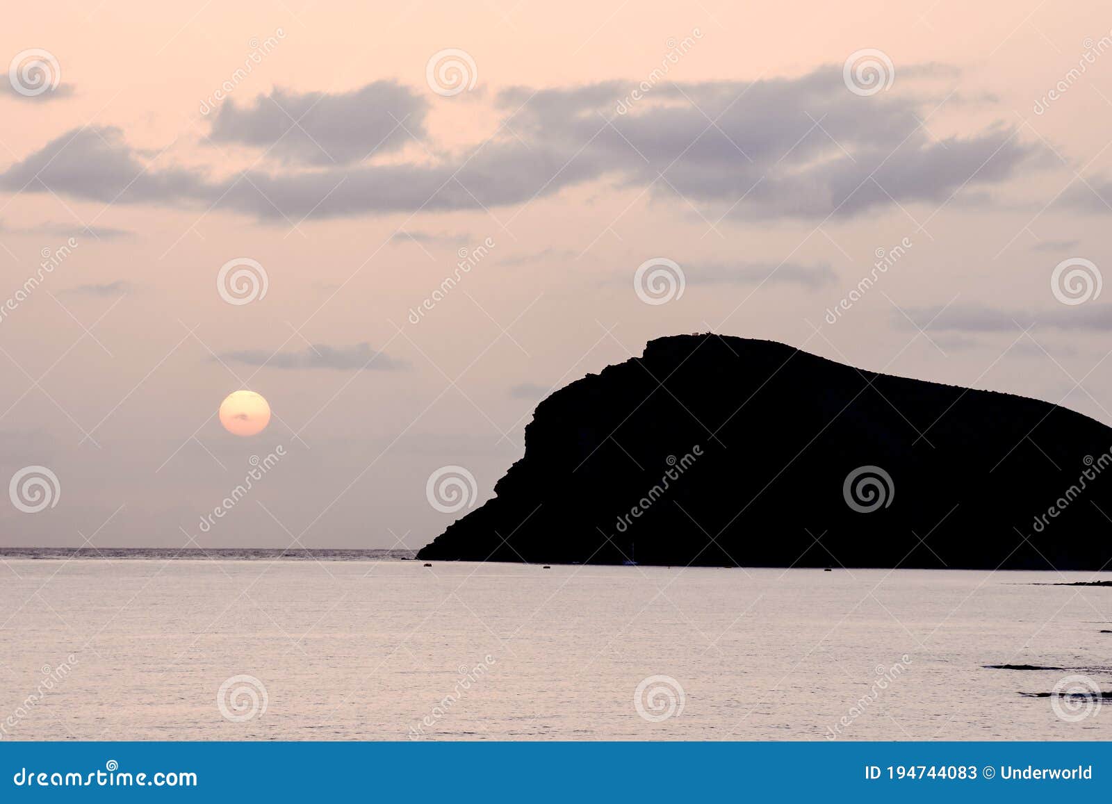 The Sun Setting in the Sea stock image. Image of time - 194744083