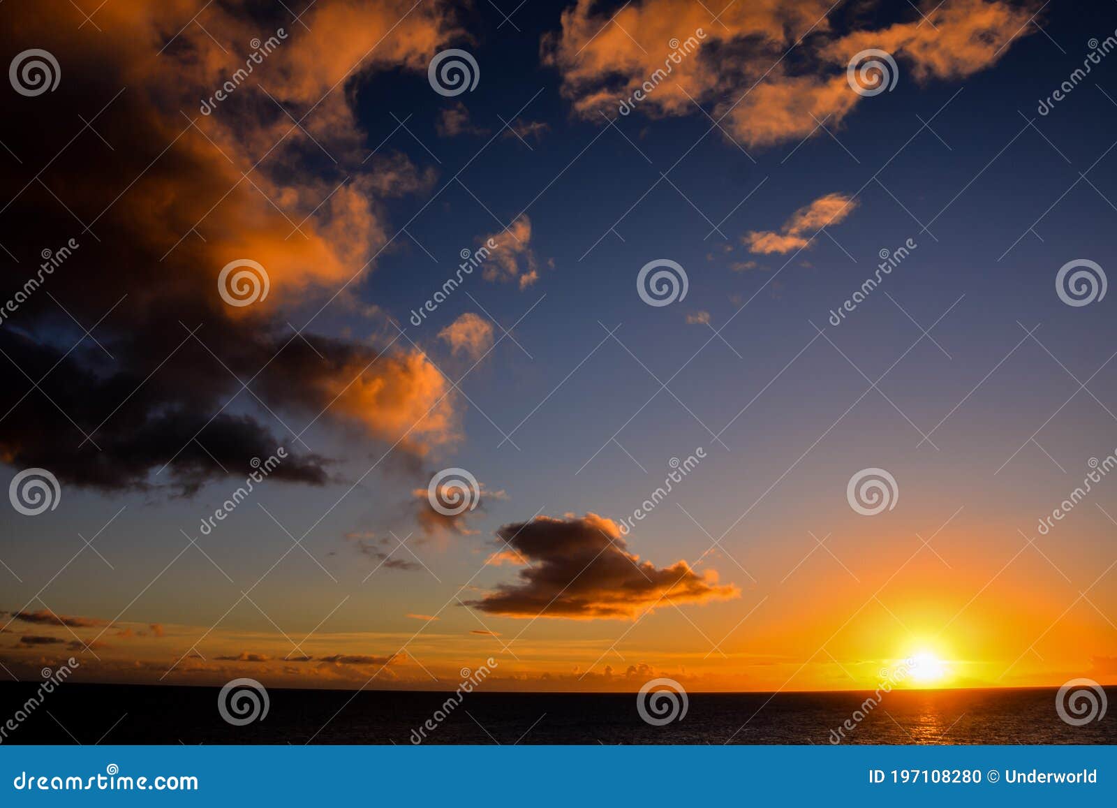 The Sun Setting in the Sea stock photo. Image of sunset - 197108280