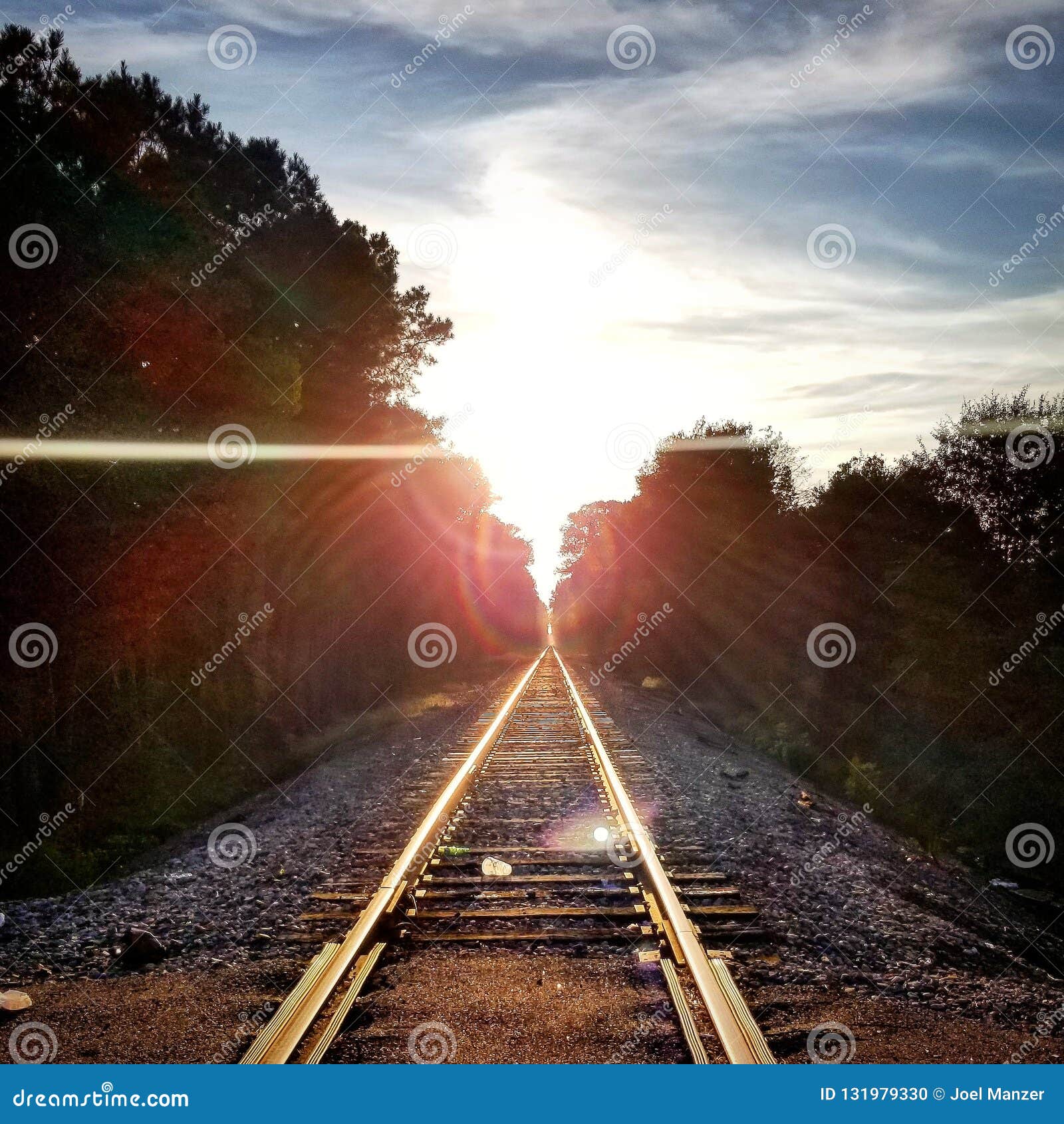 Sun Setting Using the Railroad Tracks Stock Photo - Image of tracks ...