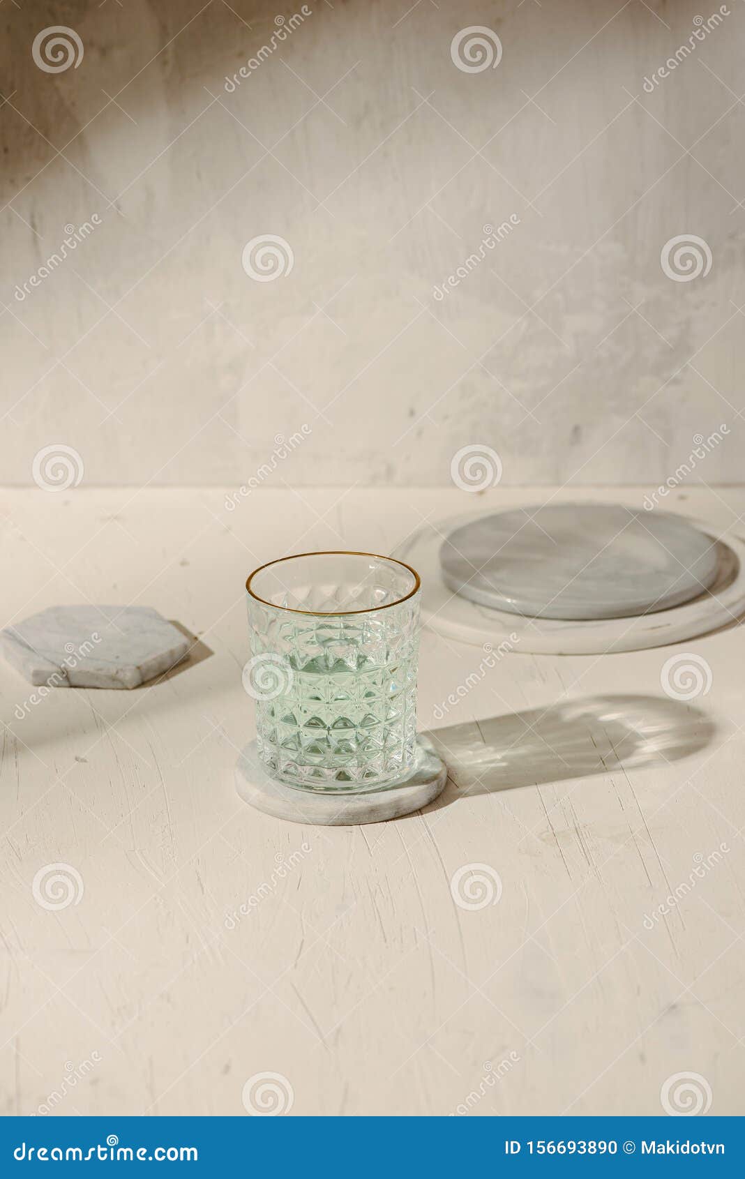 Sun Shadow on the Table with Glass of Water, Marble Plate Stock Photo ...