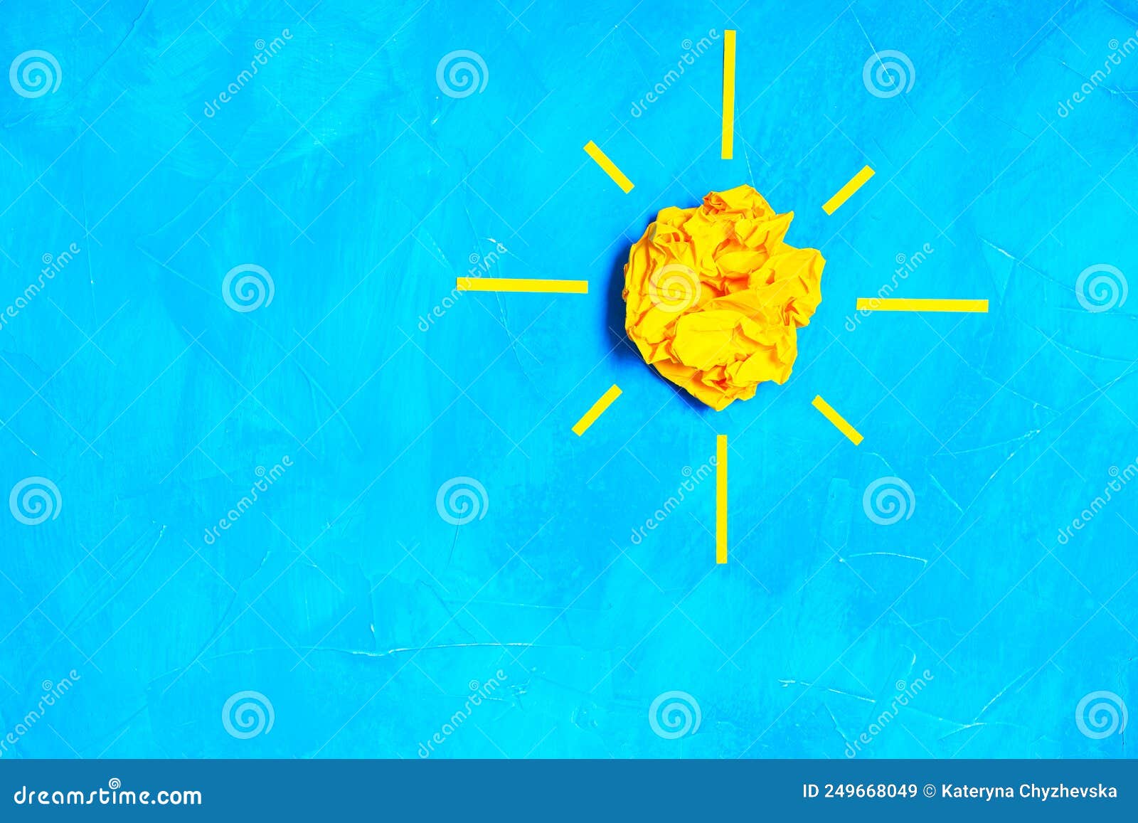 Sun Shape Made from a Crumpled Paper Ball on Blue Stock Image - Image ...