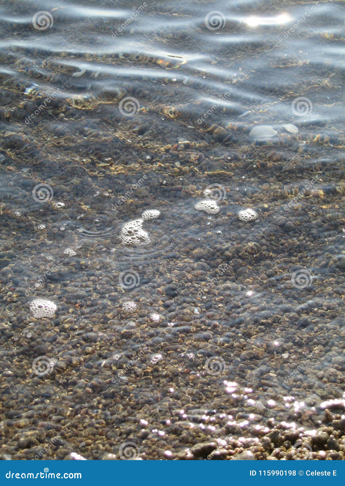 Shining Waves and Pebbles 10 Stock Photo - Image of sunlight, rocks ...