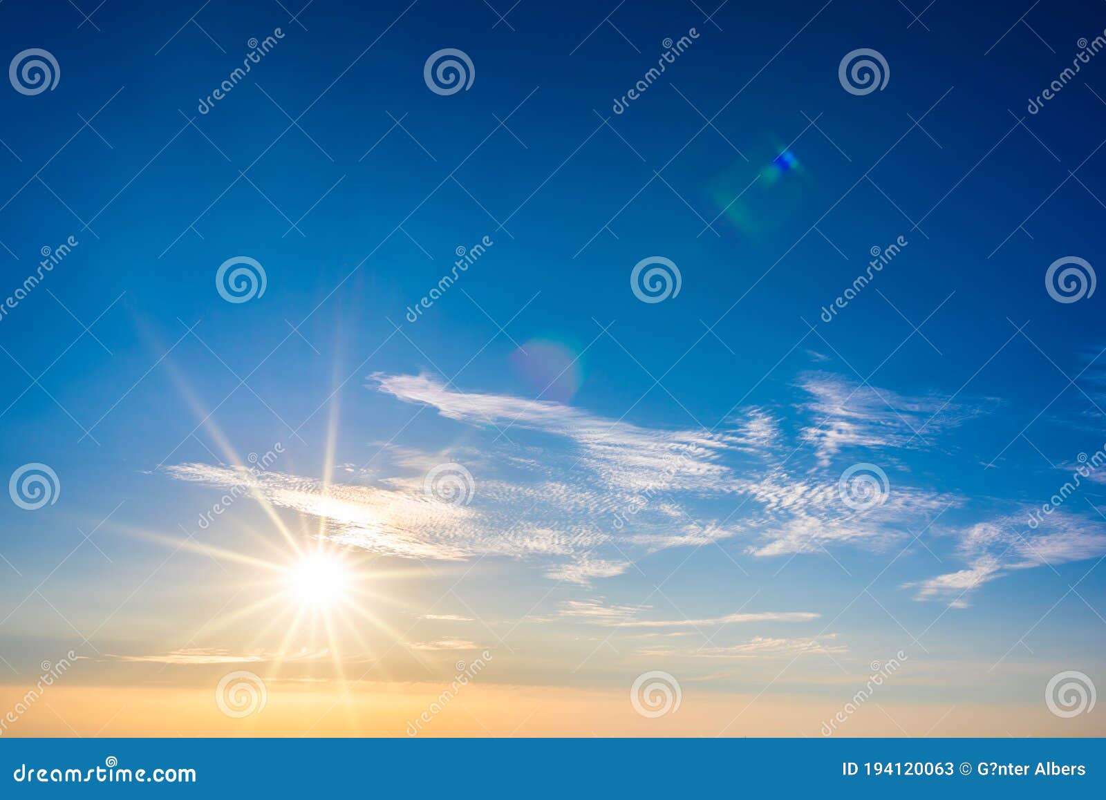 Sun shining on blue sky stock image. Image of sunrise - 194120063