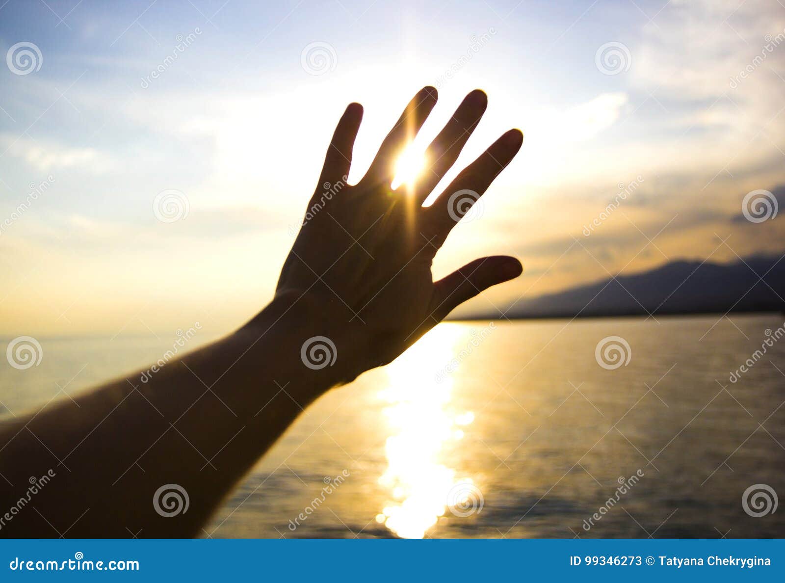 Sun Shining through the Fingers of the Hand on the Sea Background Stock ...