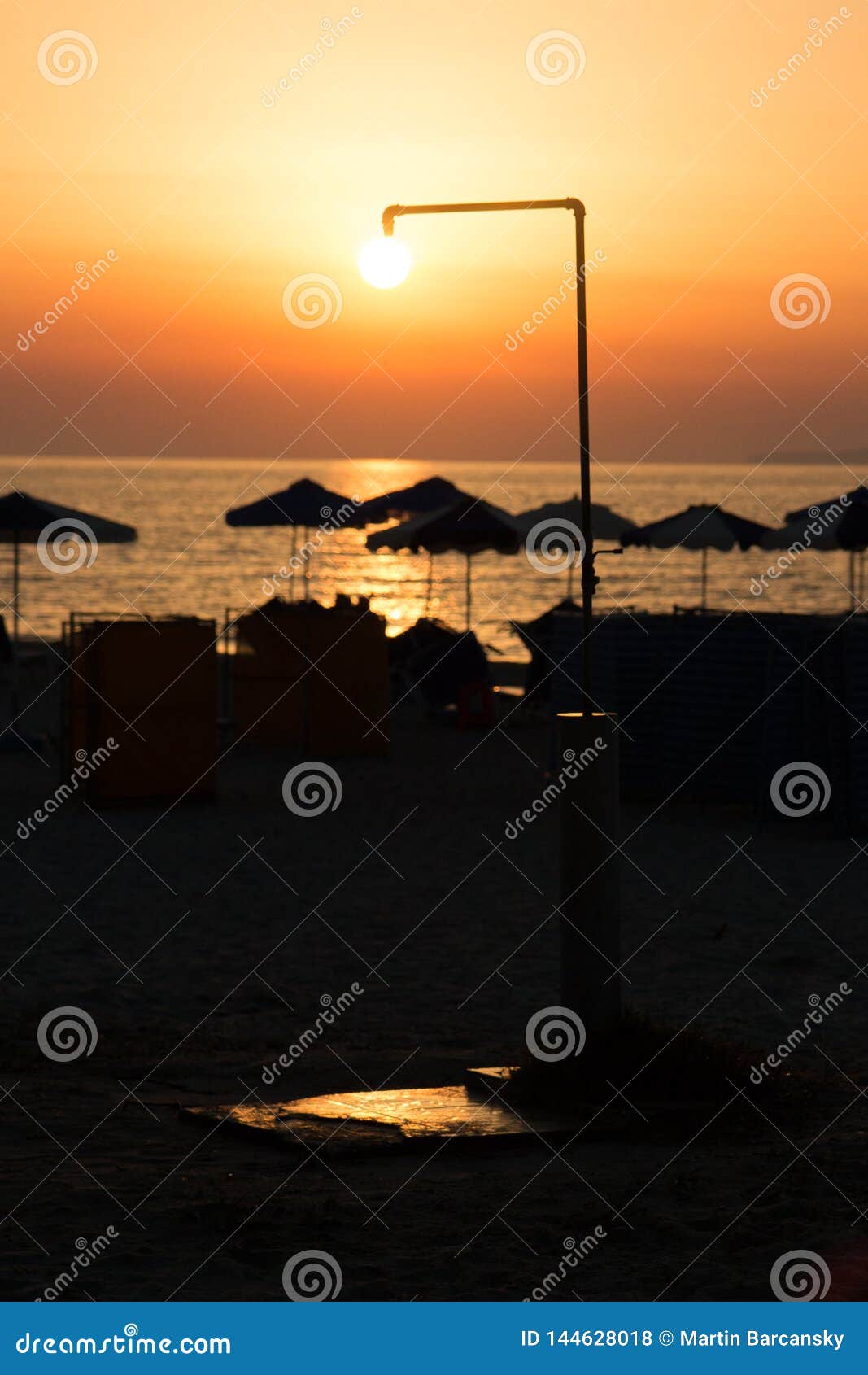 Sun shower over beach stock photo. Image of lifestyle - 144628018