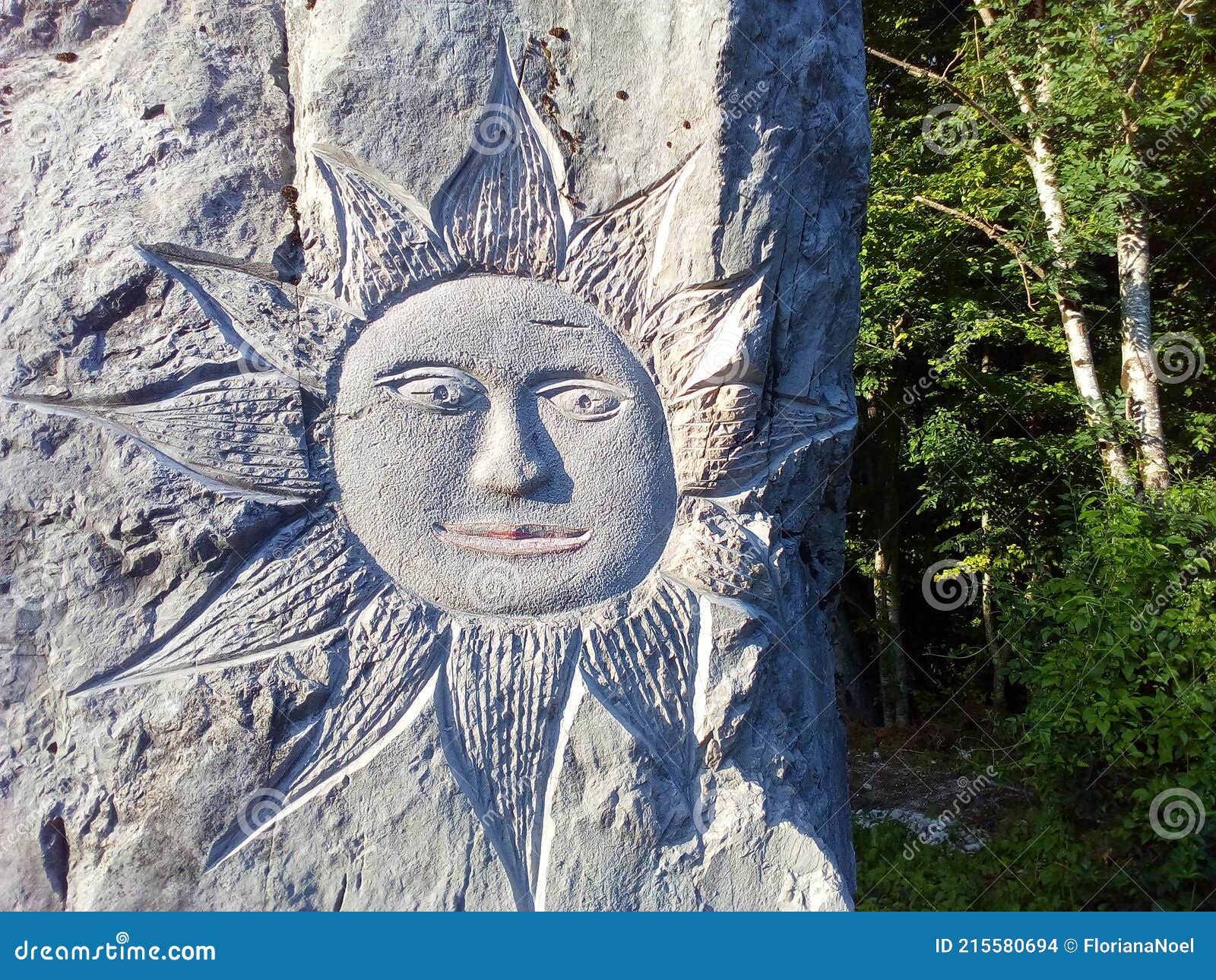 The sun carved in a stone stock photo. Image of sunbeams - 215580694