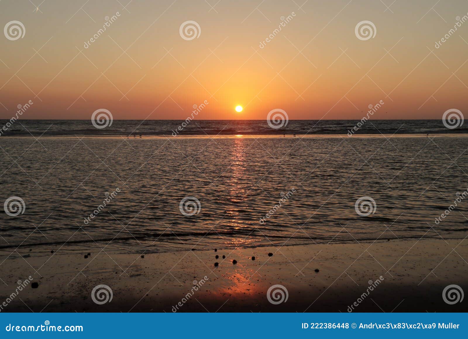 Sun Sinks into the Sea on the Beach of Katwijk with Colorful Sky Stock ...