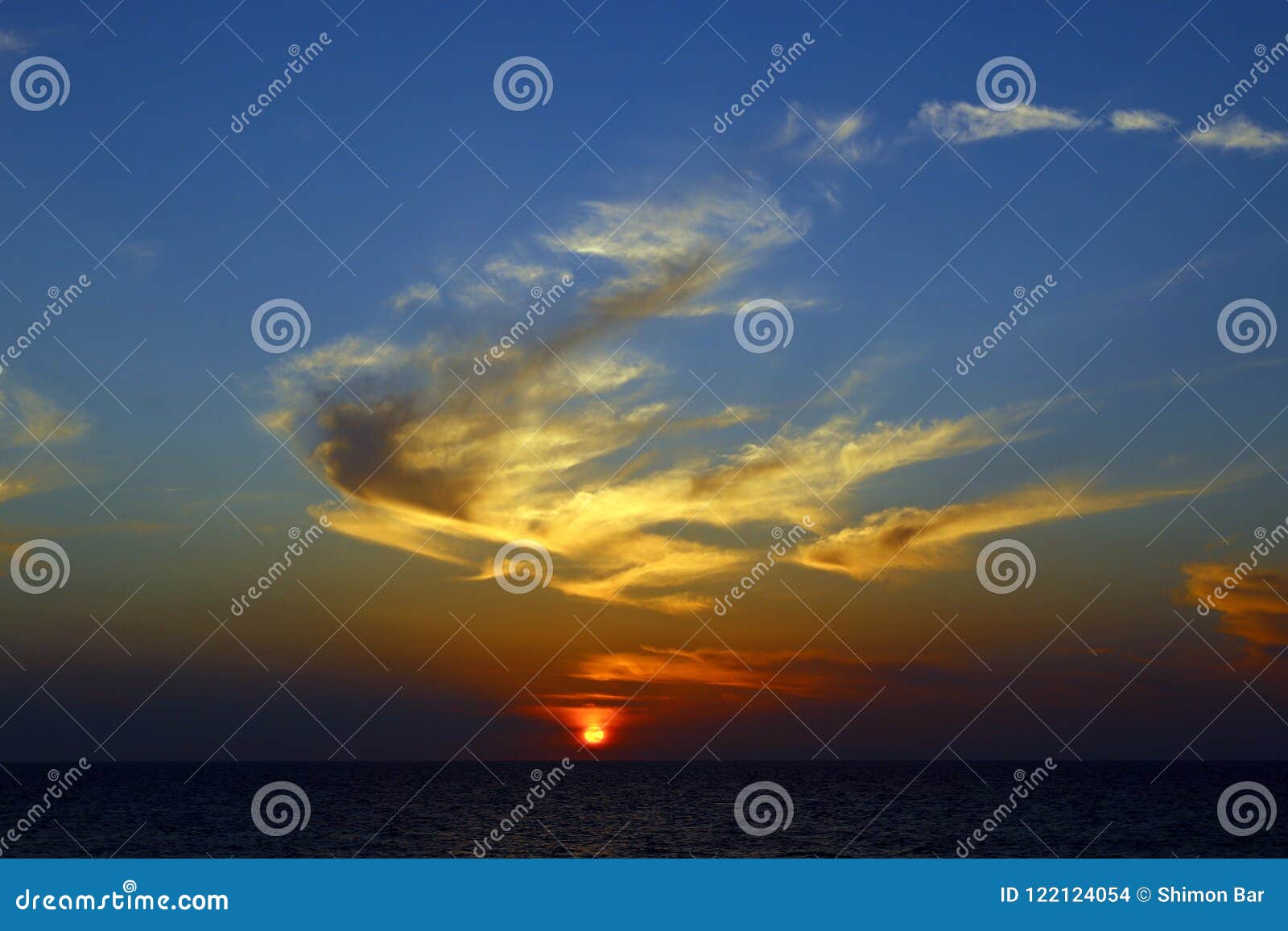 The Sun Sets Over the Horizon Stock Photo - Image of sunset, shore ...