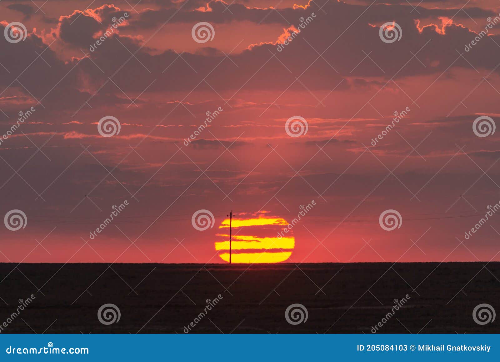 The Sun Slipping Over the Steppe at Sunset. the Circle of the Sun is ...
