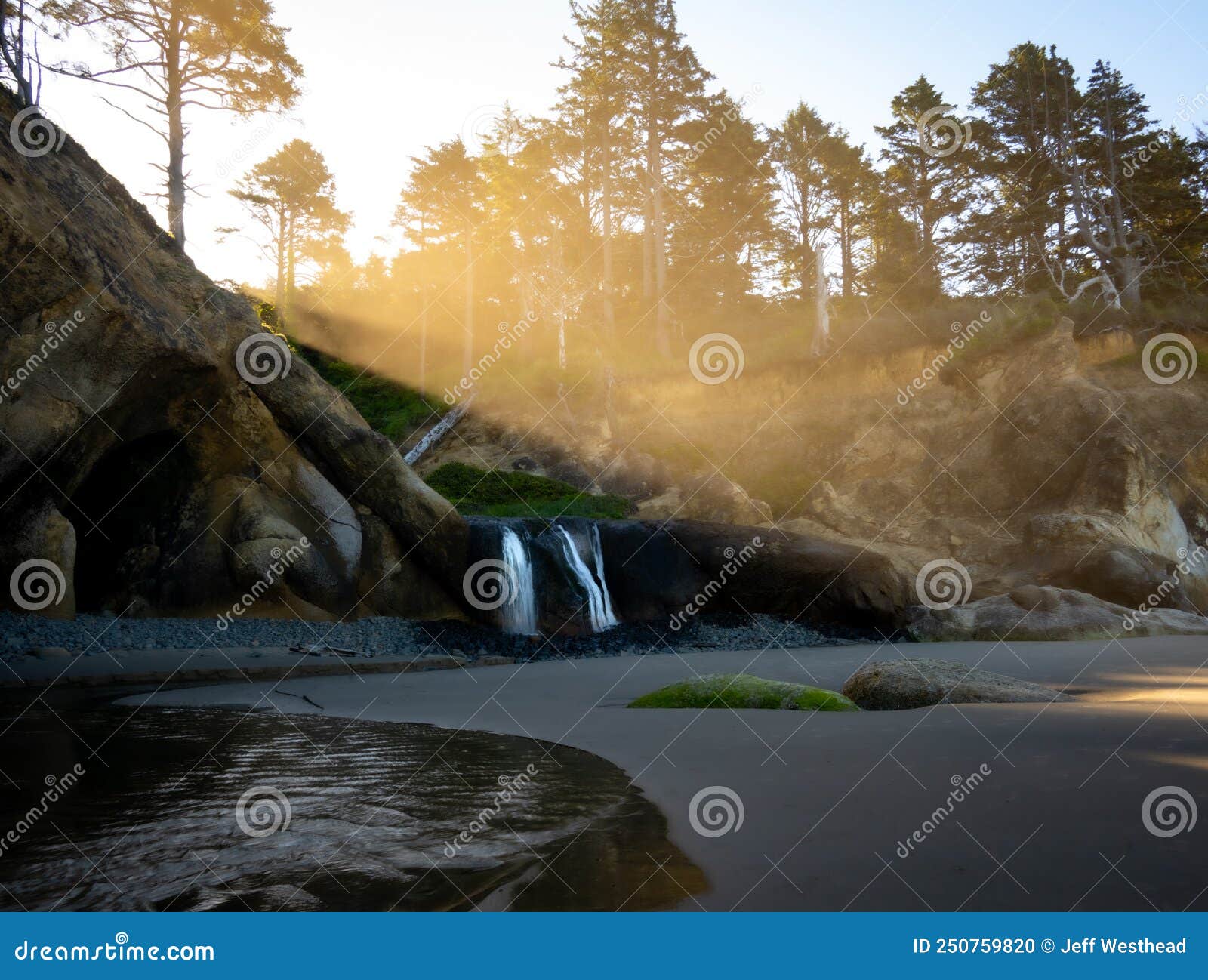 Sun Streaming Down the Cliff Over a Beach Waterfall at Hug Point in ...