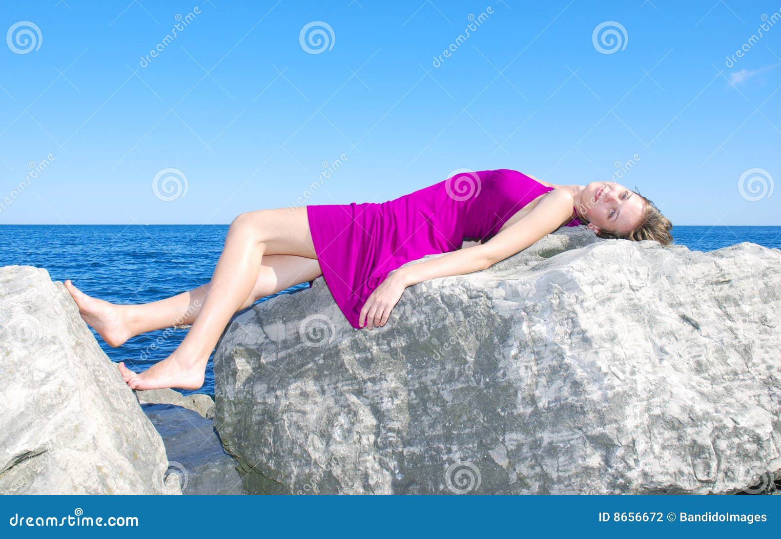 Sun tan on the rock stock photo. Image of natural, look - 8656672