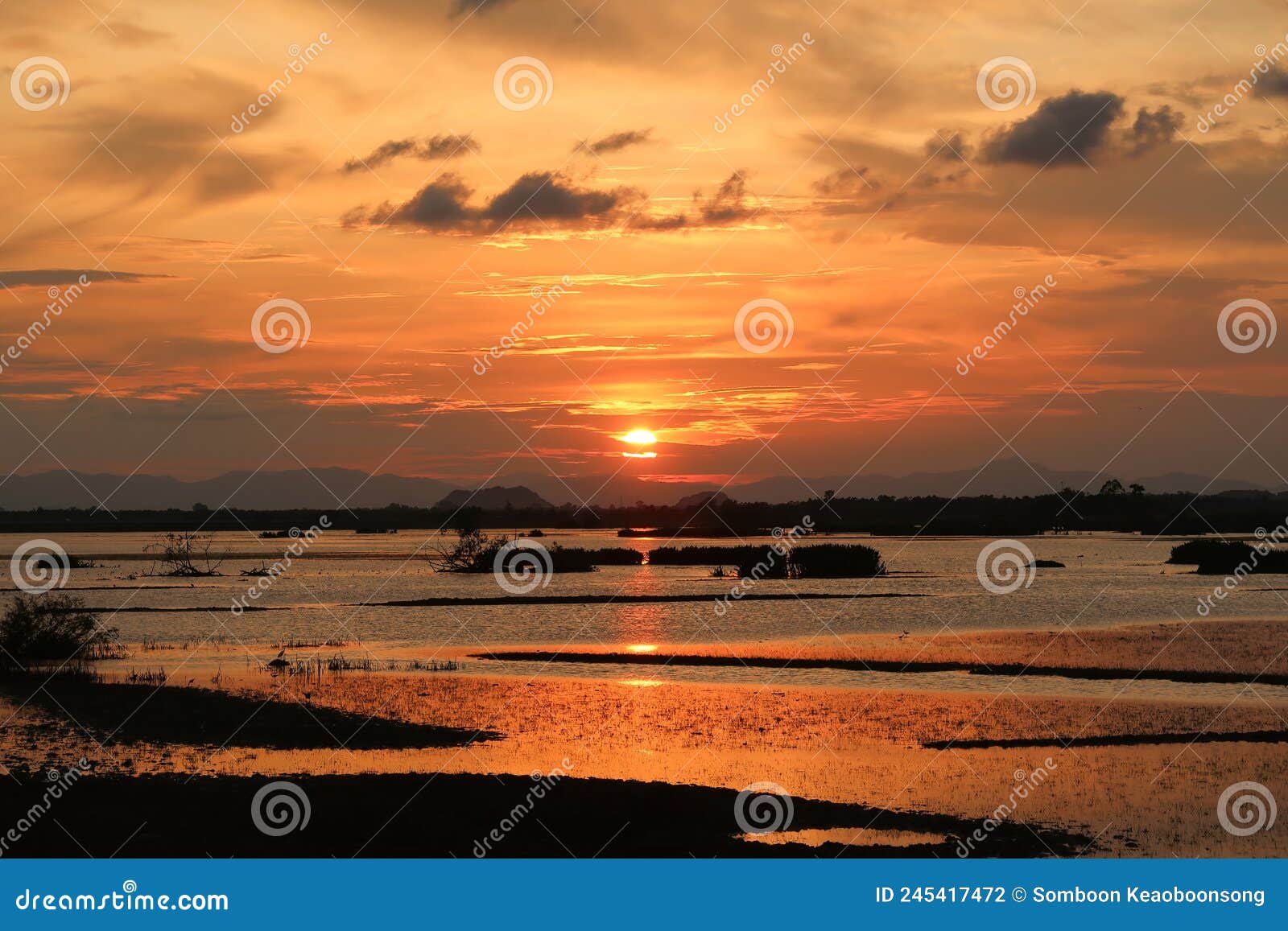 The Sun is about To Set at Dusk Over the Water and Nature Stock Photo ...