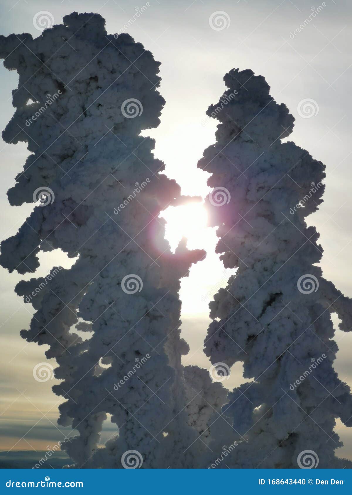 The Sun between Two Snow Pillars at Sunset Stock Photo - Image of ...