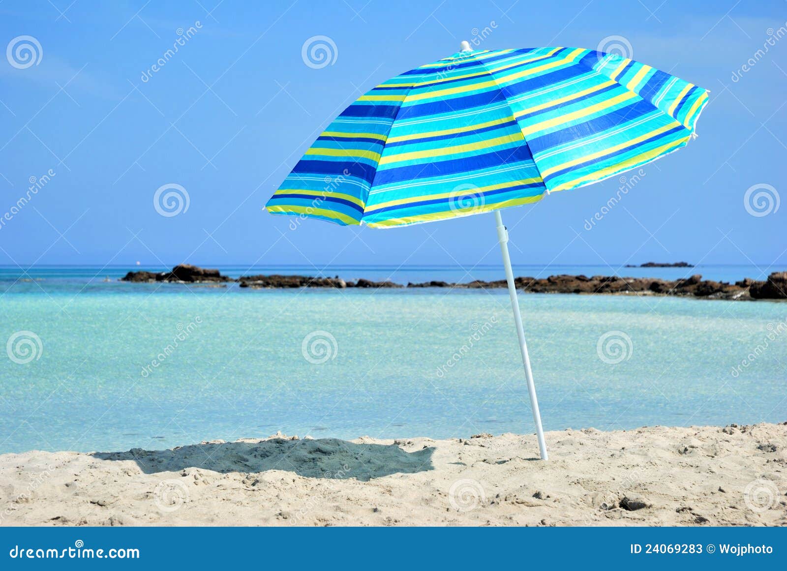 Sun Umbrella and Sea stock image. Image of ocean, stick - 24069283