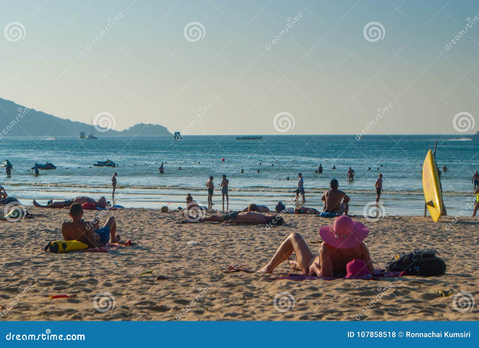 Sunbathe on the beach editorial stock photo. Image of tropical - 107858518