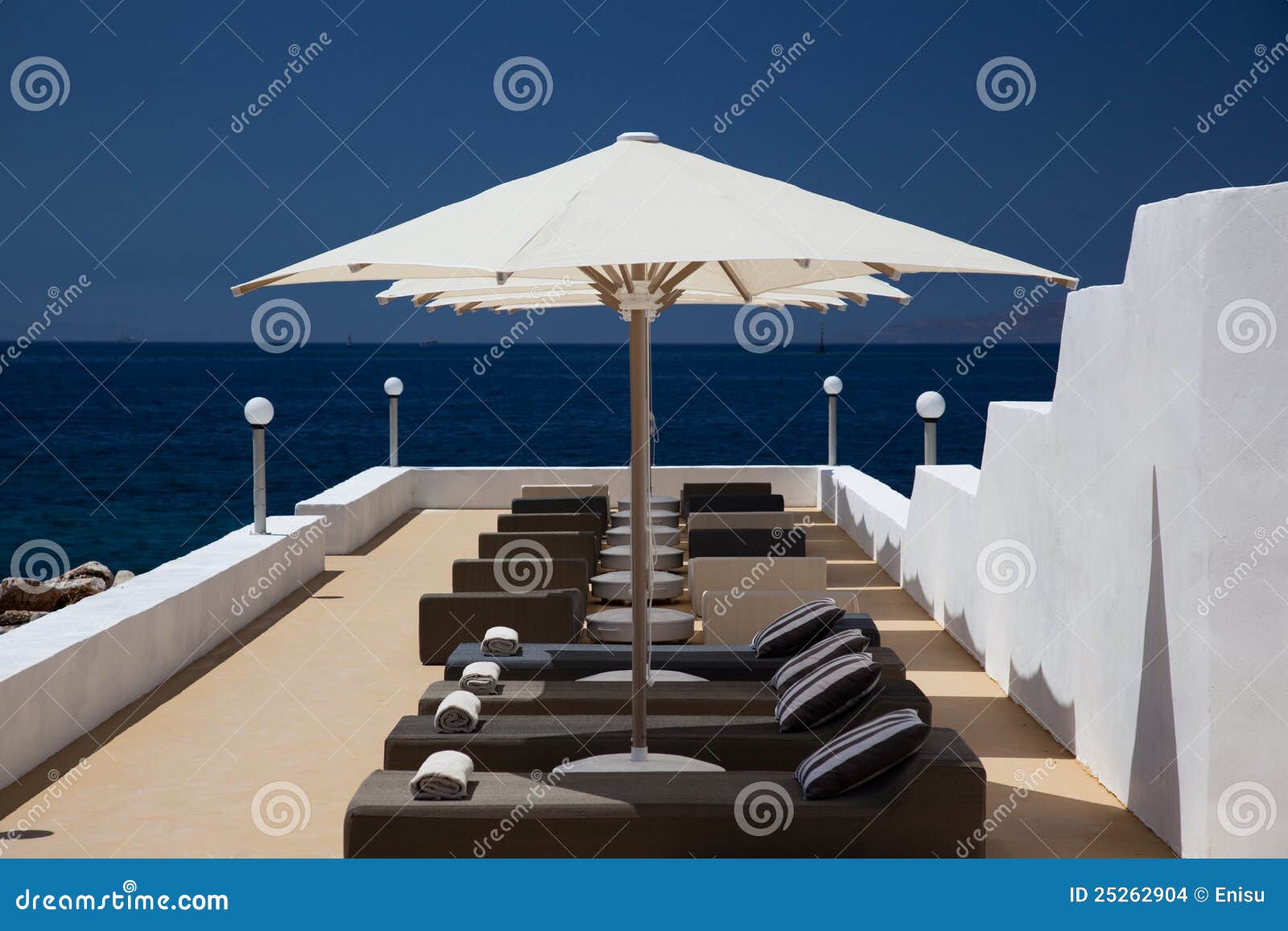 Sunbathing lounge stock photo. Image of umbrellas, seaside - 25262904