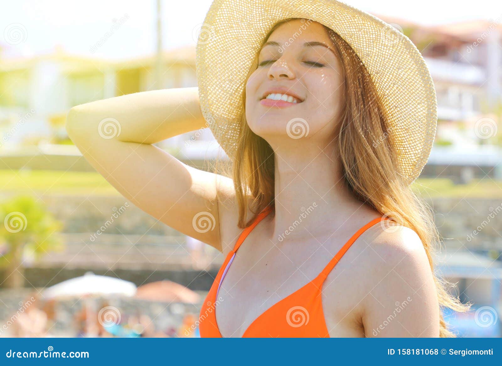 Sunbathing Young Cheerful Bikini Woman With Hat Enjoying Sun On
