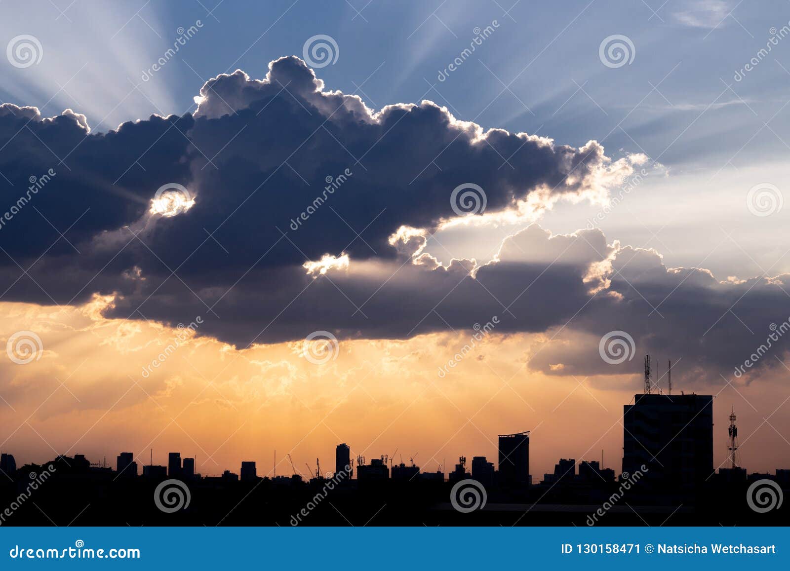 Sunbeam through the Dramatic Cloud during Sunset Time, with Silhueete ...
