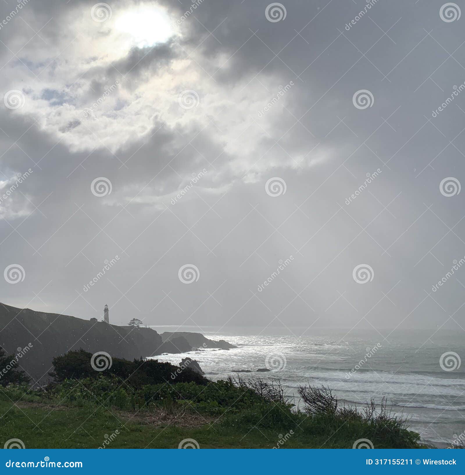 Sunbeam Shining on Heceda Head Lighthouse Amid Clouds Stock Image ...