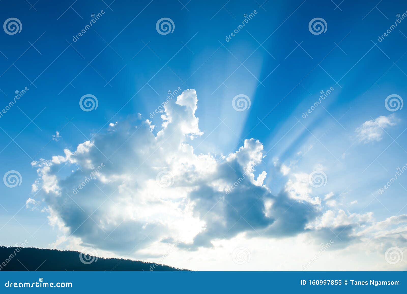 Sunbeams Shines through the Cloud Over a Mountain Stock Image - Image ...