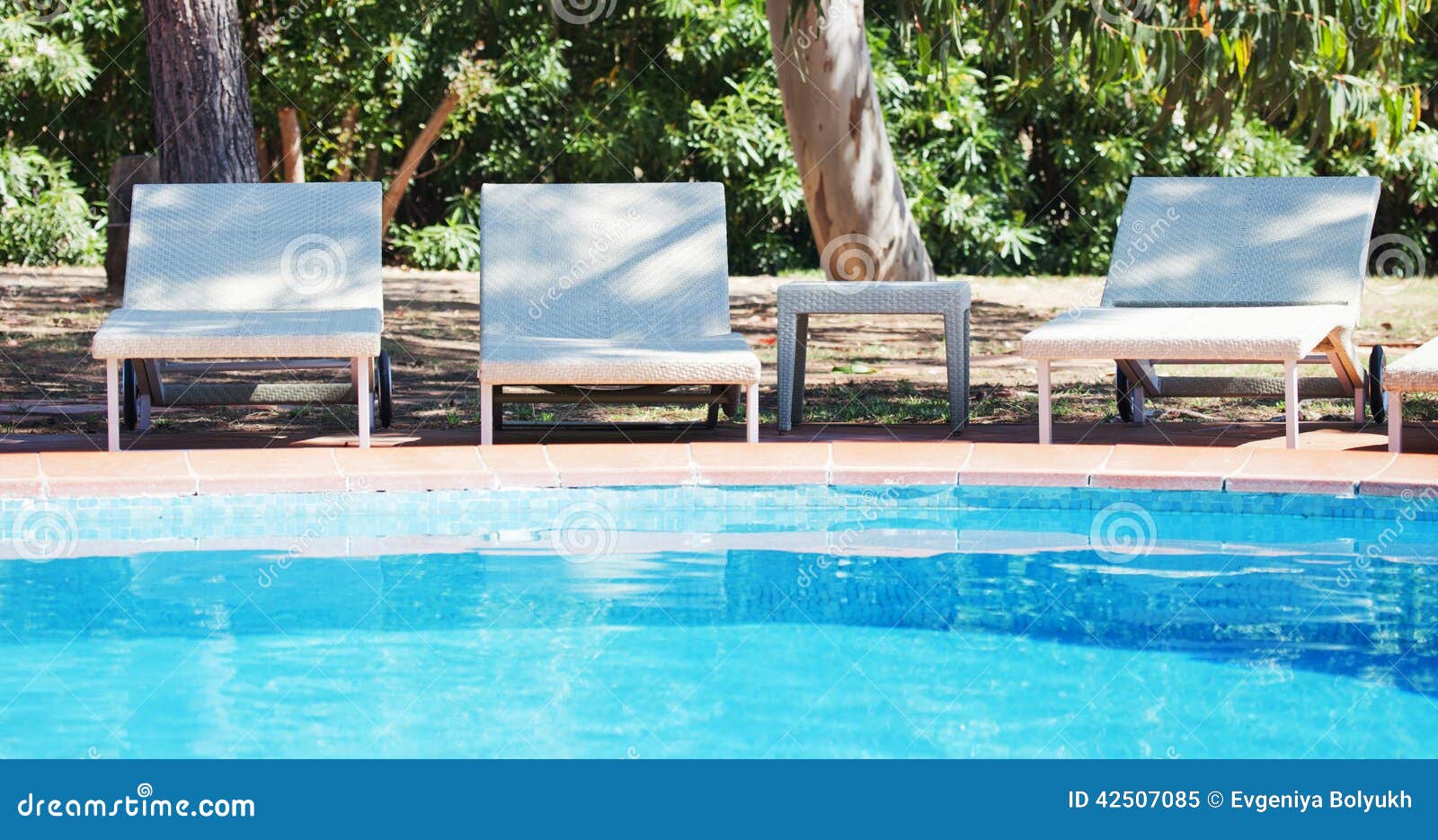 Sunbed and swimming pool stock image. Image of holidays - 42507085