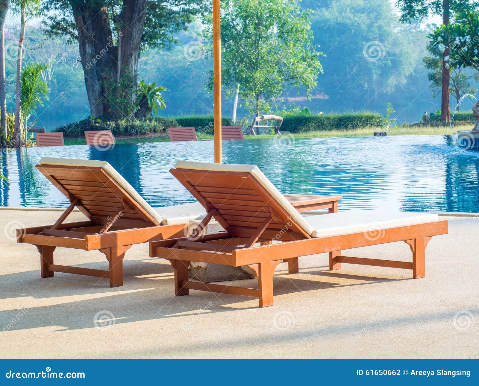 Sunbeds Placed beside Swimming Pool Stock Photo - Image of pool ...