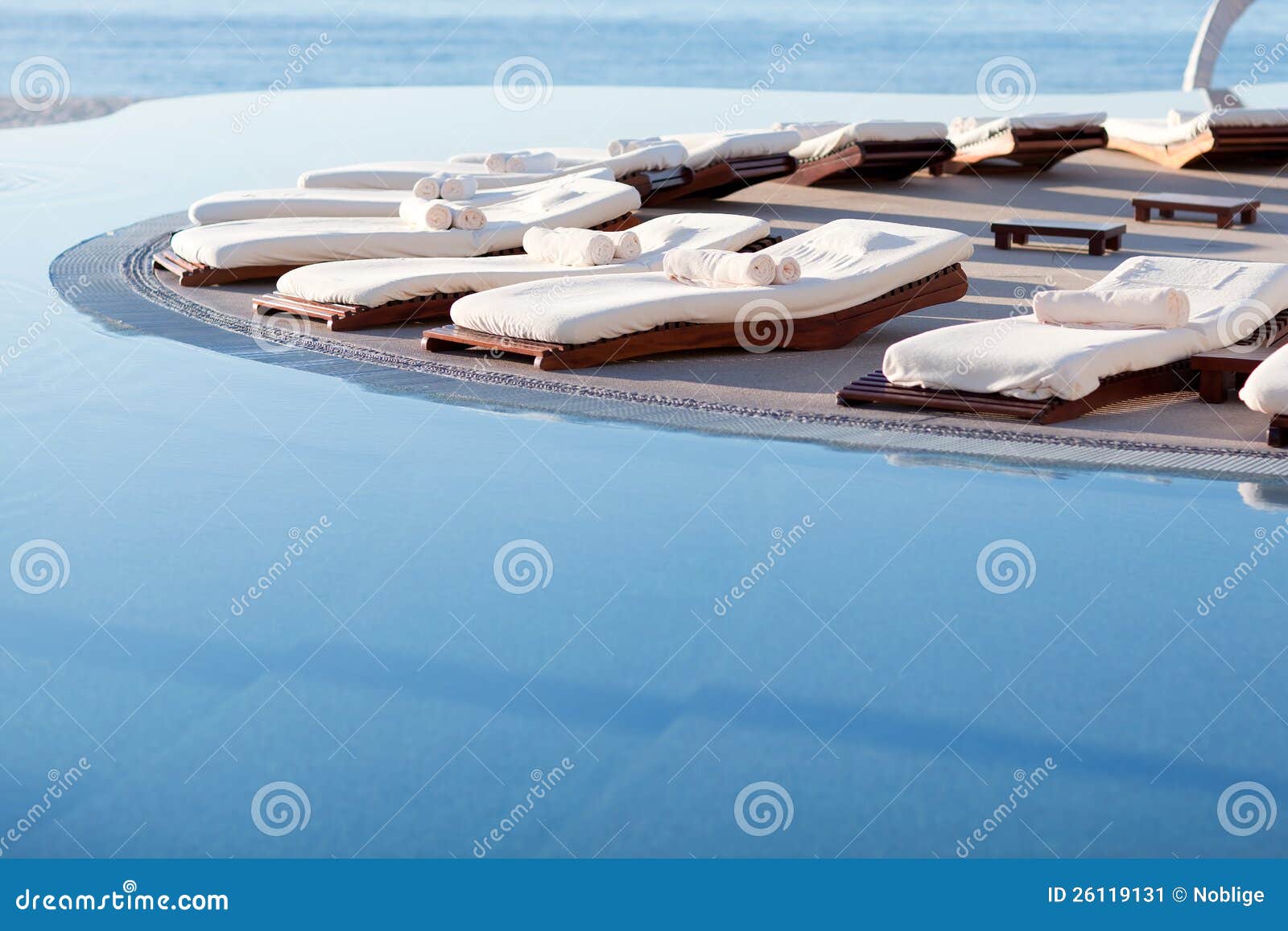 Sunbeds by the pool stock image. Image of relax, seascape - 26119131