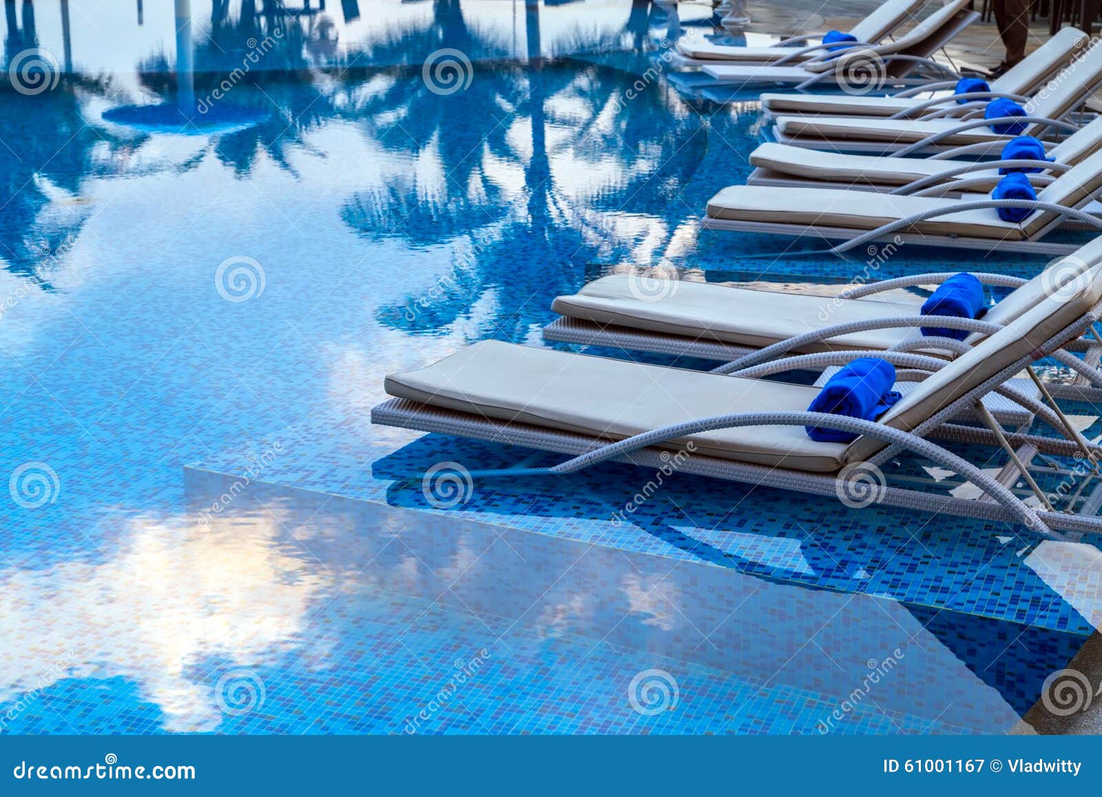 Sunbeds beside Swimming Pool Stock Image - Image of lounge, coastline ...