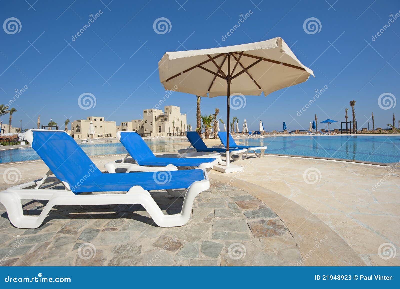 Sunbeds by a Tropical Resort Swimming Pool Stock Image - Image of ...