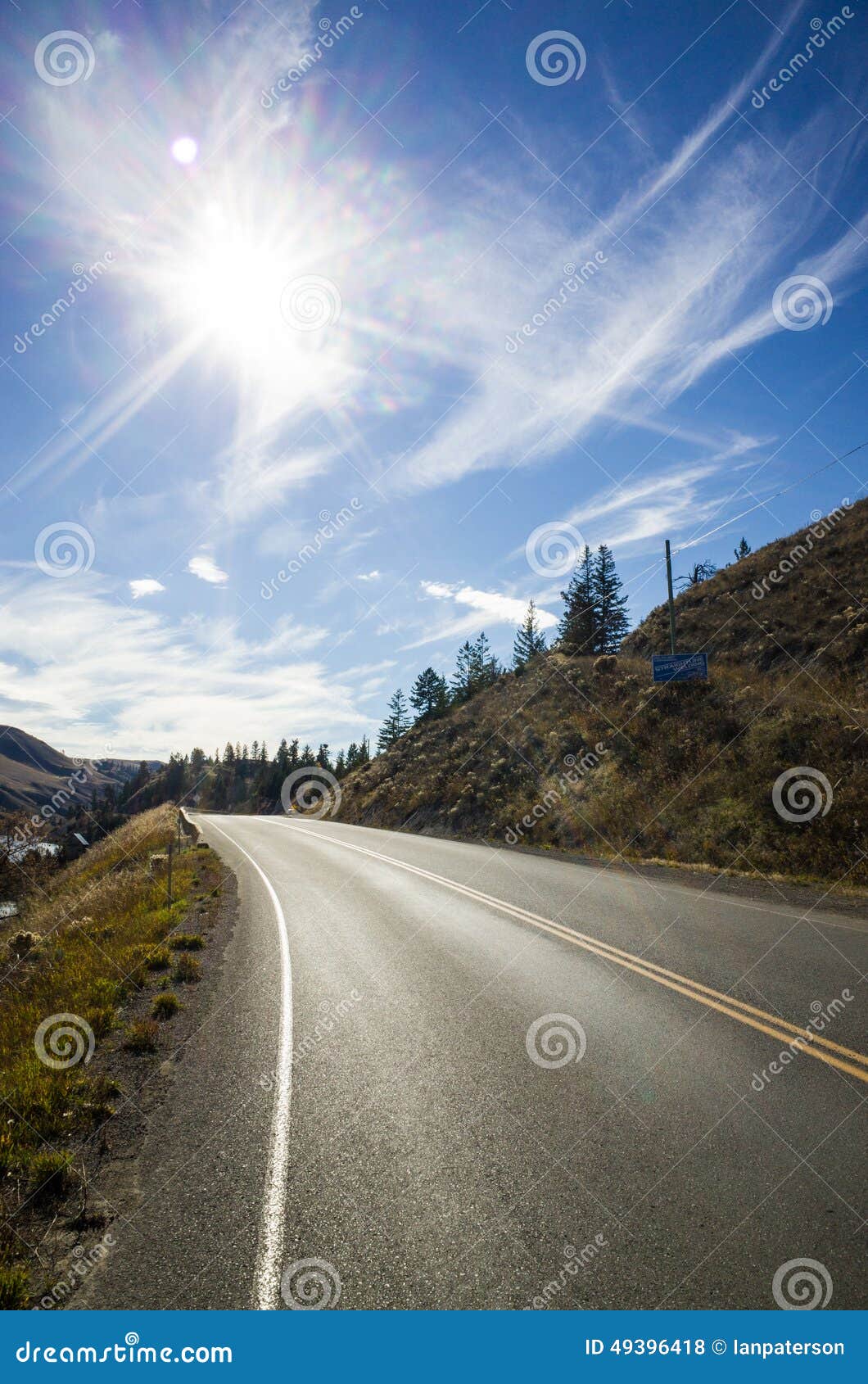 Sunburst Above an Empty Tarred Road Stock Photo - Image of illuminated ...