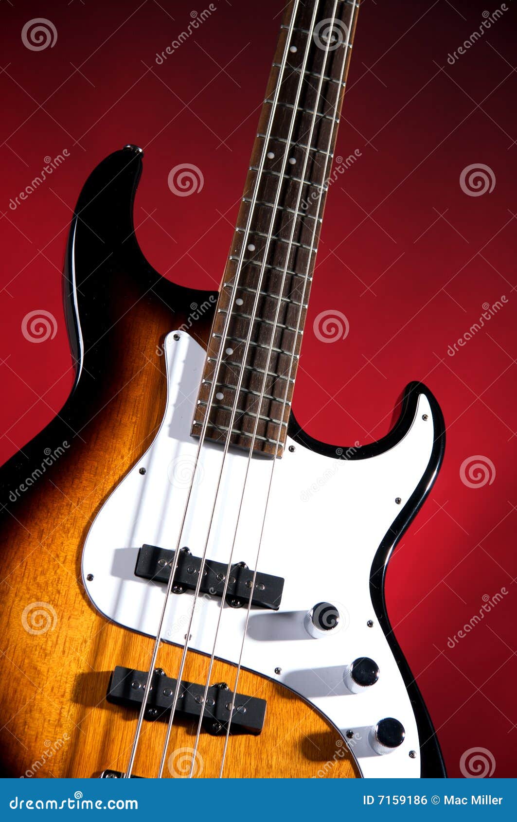 Sunburst Bass Guitar Isolated on Red Stock Photo - Image of vertical ...