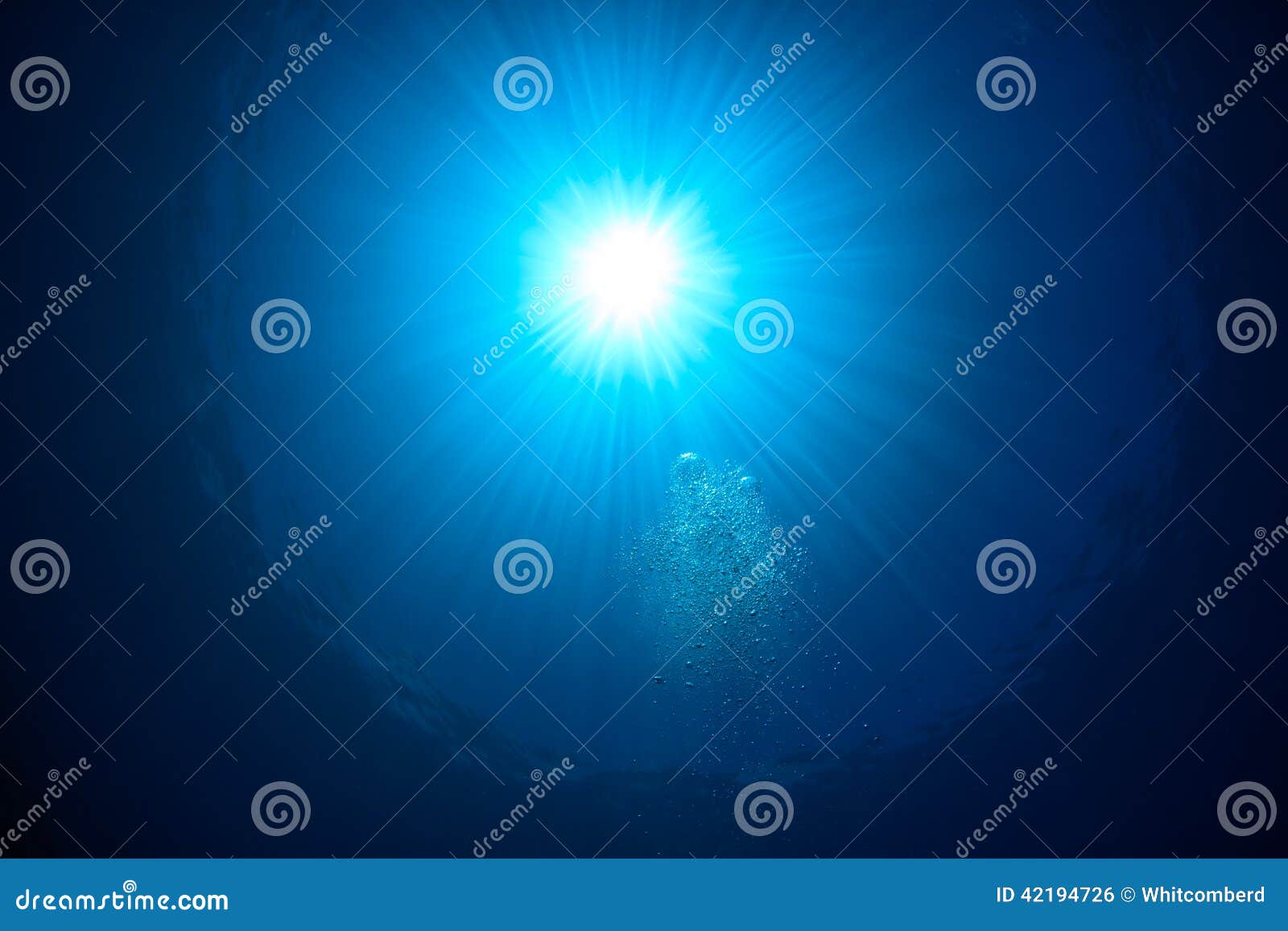 Sunburst and Bubbles on the Ocean Surface Stock Photo - Image of light ...