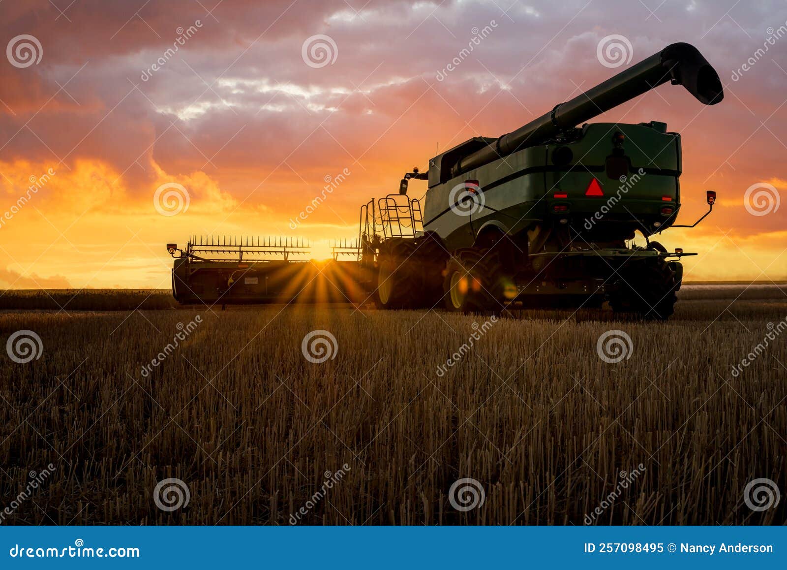Sunburst through Combine at Sunset on the Prairies in Saskatchewan ...