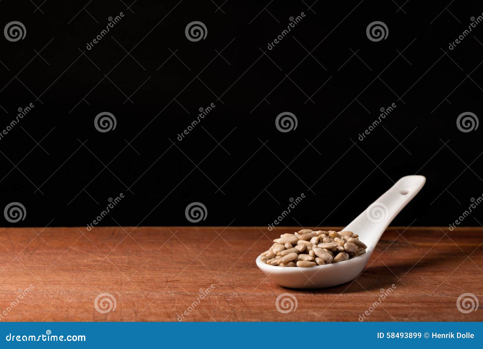 Sunflower seed on a spoons stock image. Image of genus - 58493899