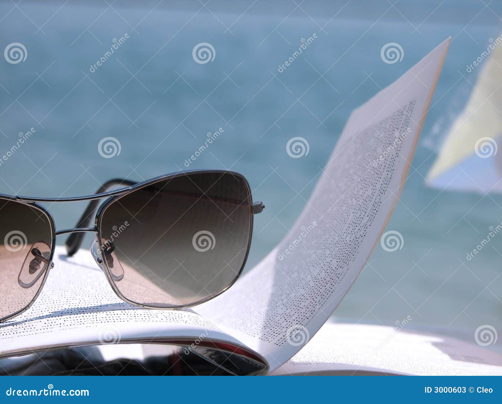 Sunglass on the book stock image. Image of glass, shadow - 3000603