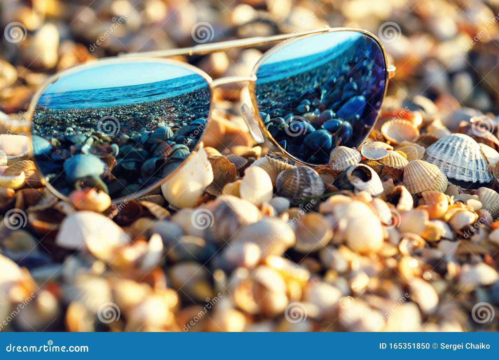 Sunglasses on the Beach with Sea Reflection in Them Stock Photo - Image ...