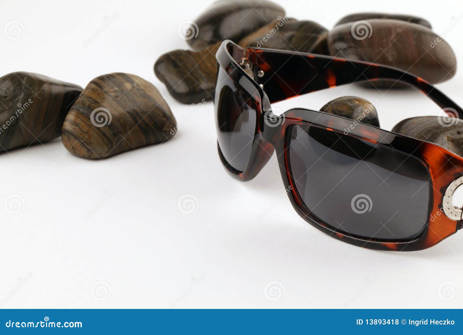 Sunglasses and pebbles stock photo. Image of brown, sunglasses - 13893418