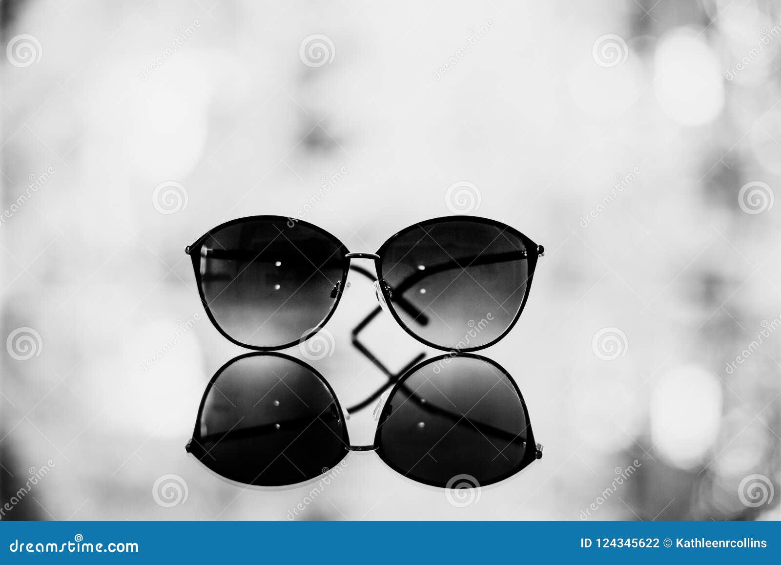 Sunglasses Resting on Glass Monochrome Stock Photo - Image of frames ...