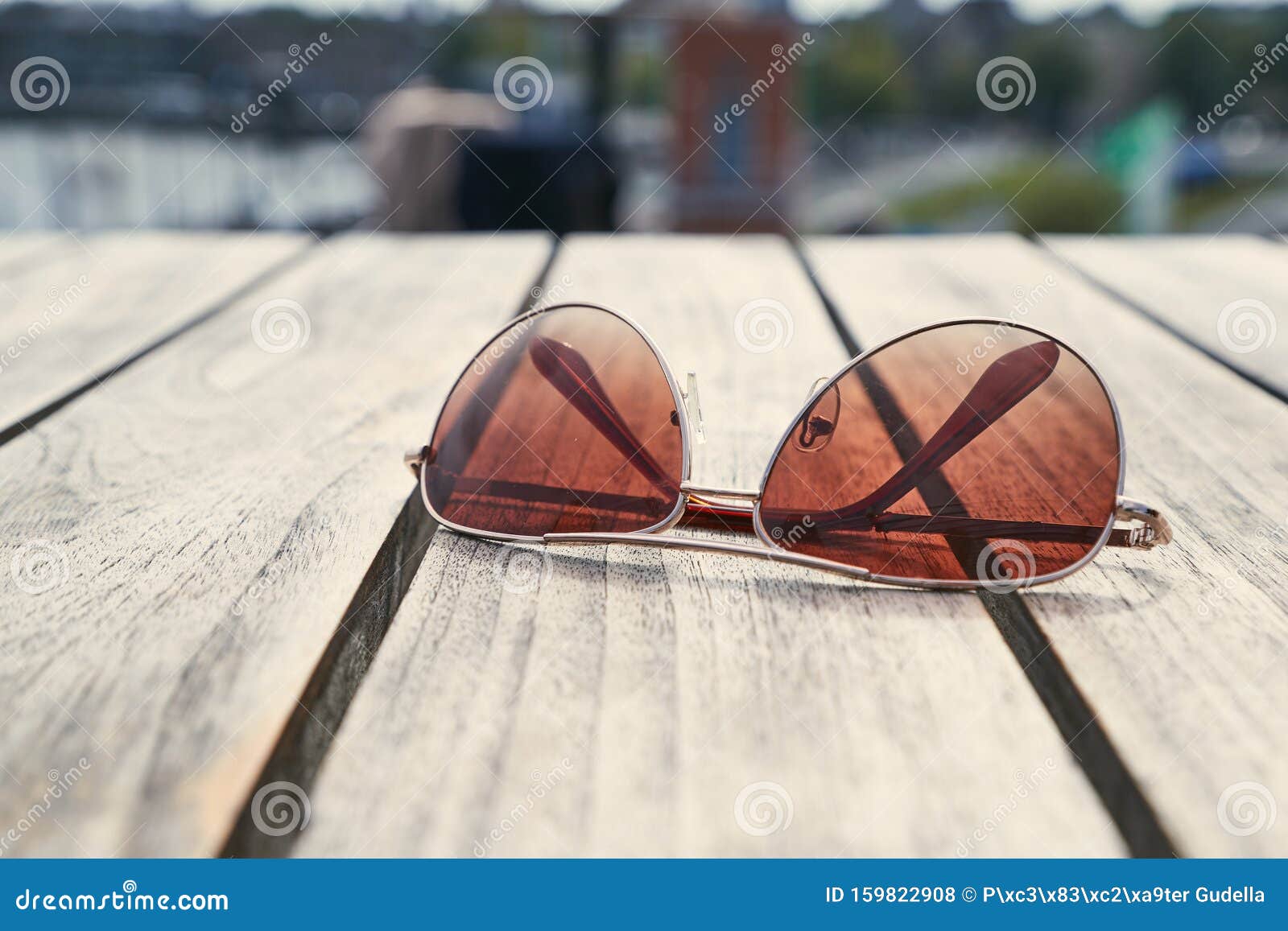 Sunglasses on a table stock photo. Image of shade, personal - 159822908