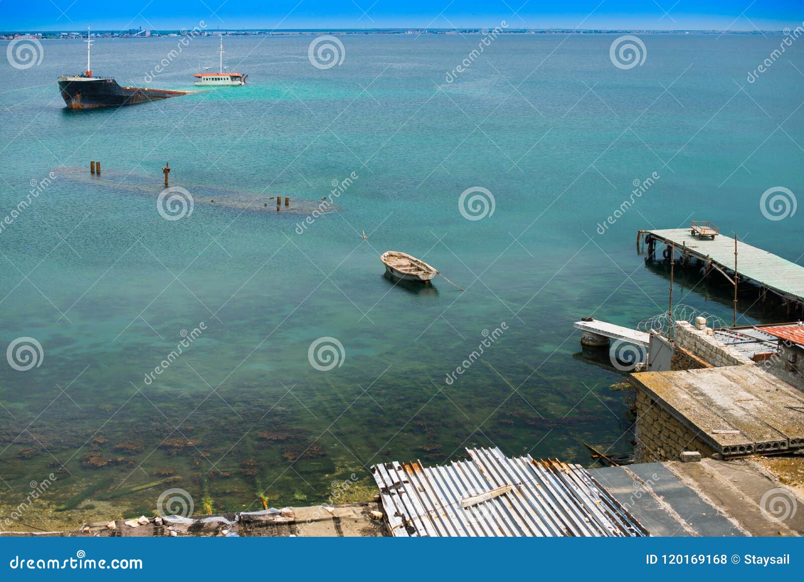 Sunken Ship Near Old Abandoned Docks on the Shore Stock Photo - Image ...
