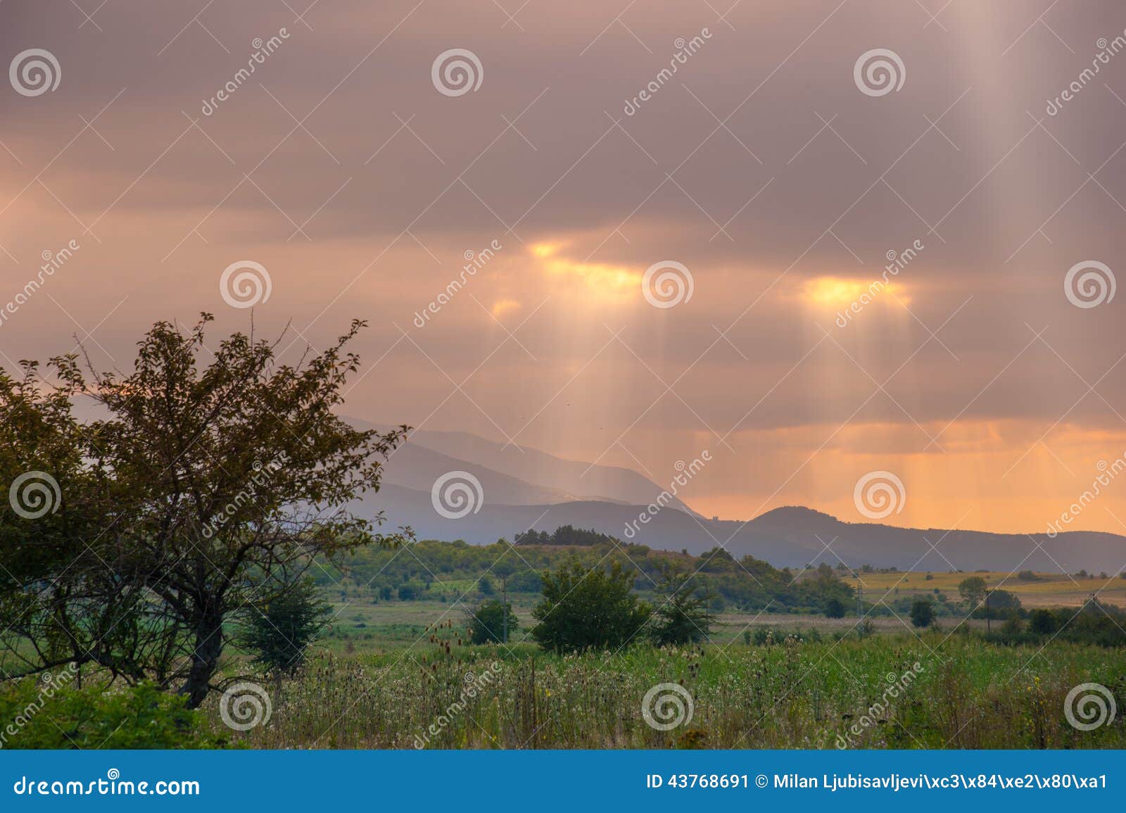 Sunlight through Clouds stock image. Image of beautiful - 43768691