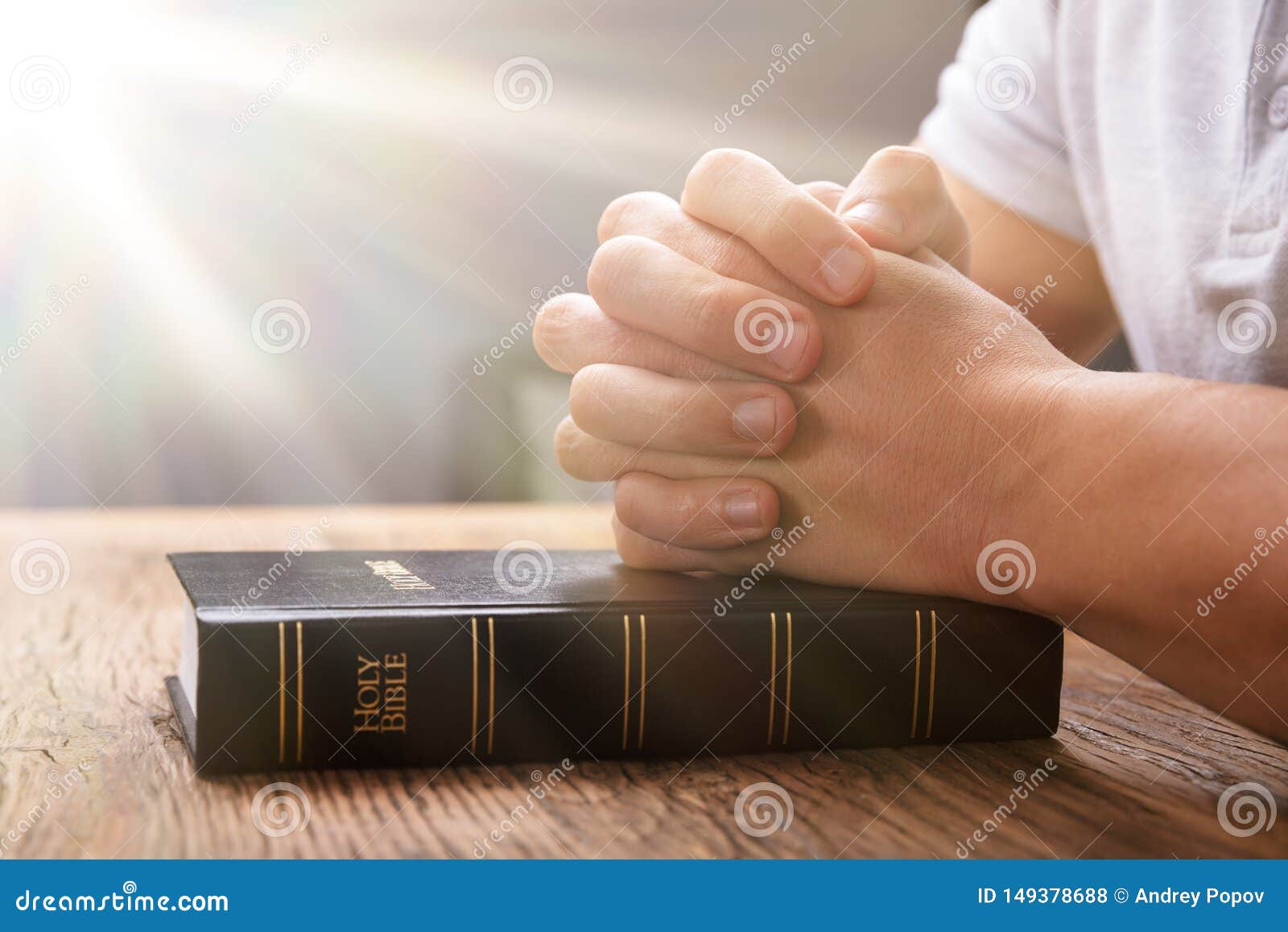 Man`s Praying Hand on Bible Stock Photo - Image of finger, bible: 149378688