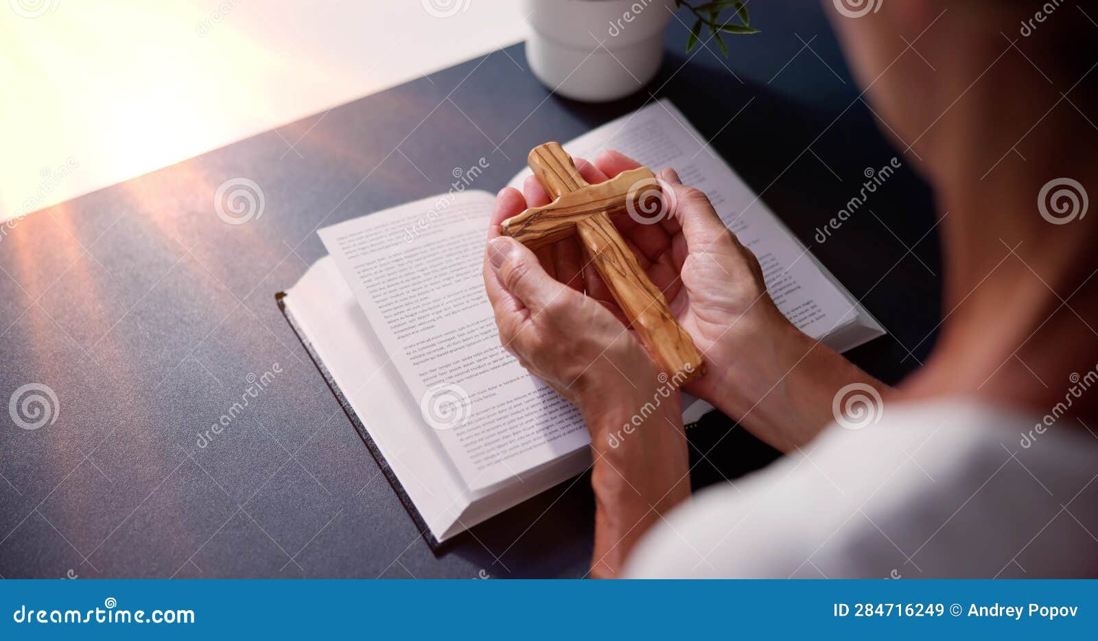 Sunlight Falling on Hand Over Bible Stock Image - Image of praying ...