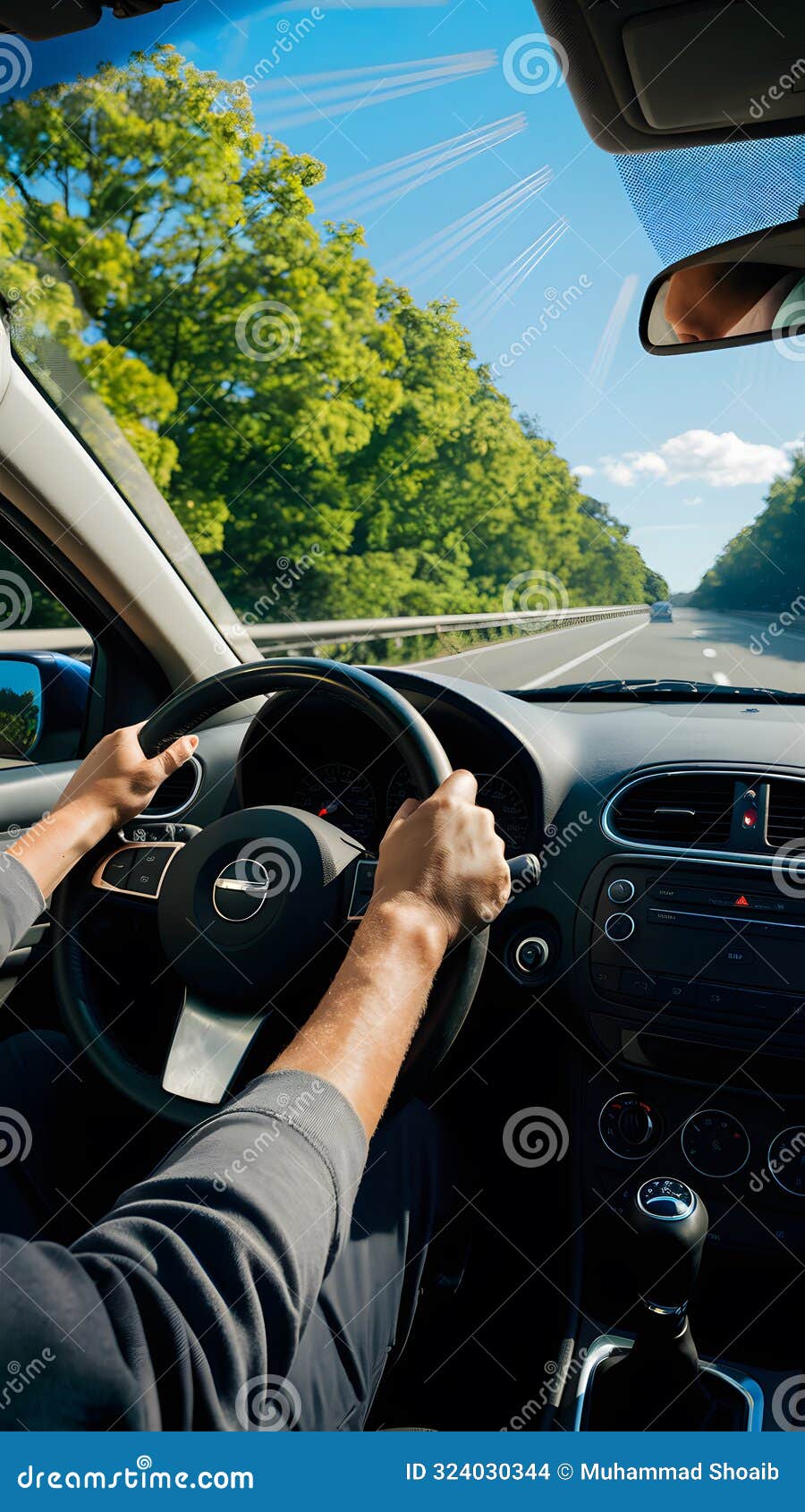 Sunlight Illuminates Car Dashboard and Driver on Tree Lined Highway ...