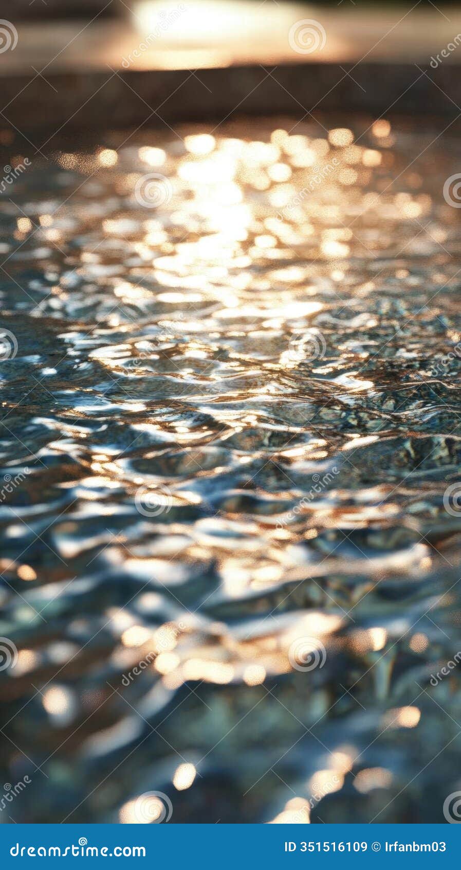 Sunlight Reflects on Rippling Water Surface with Golden Light and ...