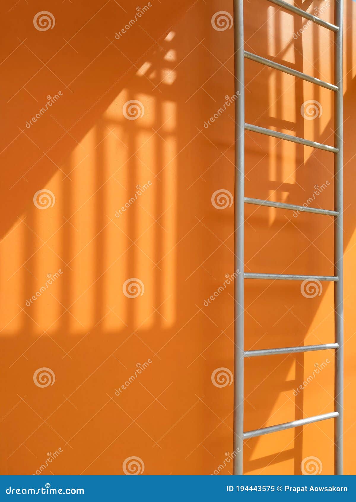 Side View of Fire Escape Outside of Orange Building in Vertical Frame ...