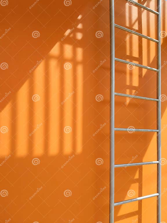 Side View of Fire Escape Outside of Orange Building in Vertical Frame ...
