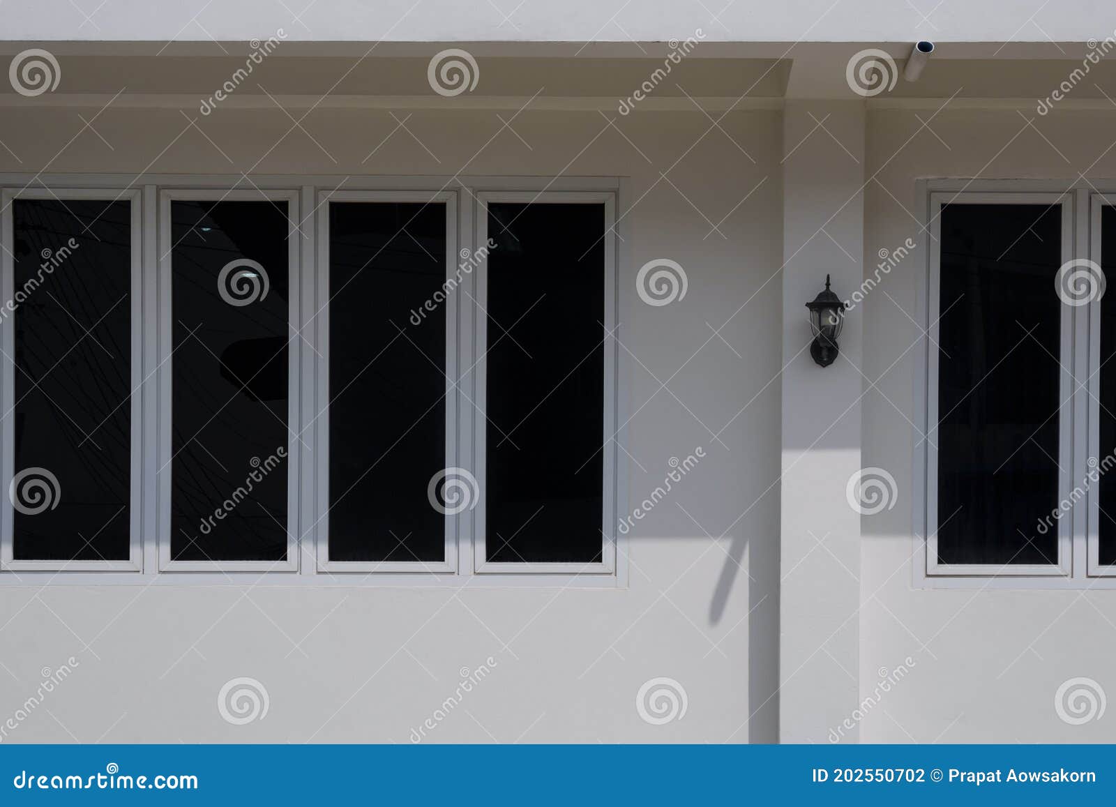 Sunlight and Shadow on Glass Windows Surface Outside of House Building ...