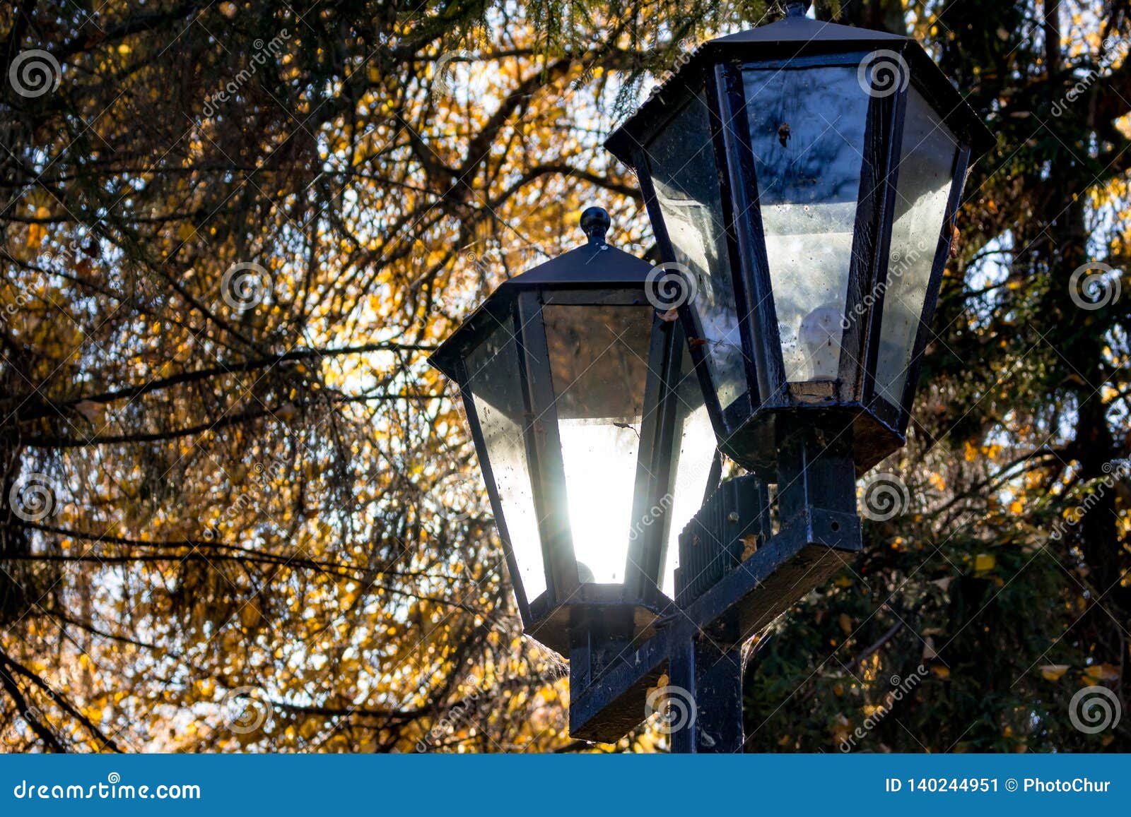 Sunlight Shines through a Street Lamp during the Day Stock Image ...