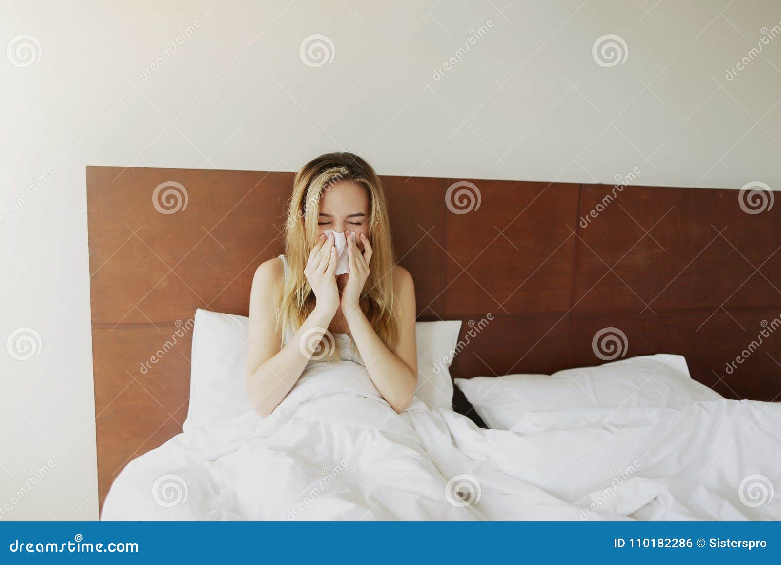 Sunlight Sick Adult Woman Got Cold Sneezes In White Bed With Napkin